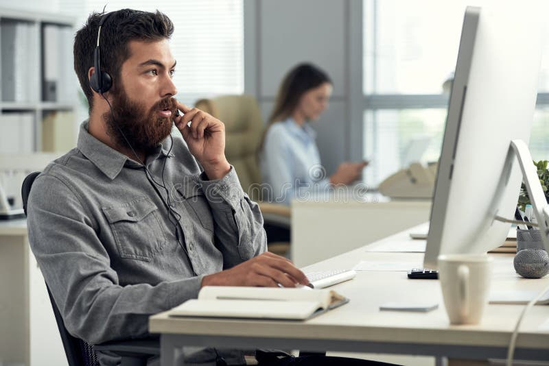 Casual Man Working in Customer Support Office Stock Image - Image of ...