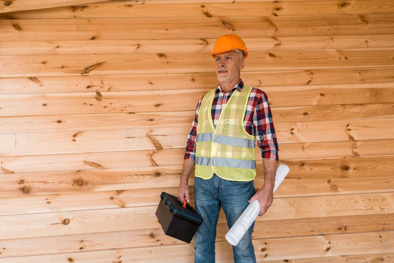 Middle Aged Man Holding Tool Box and Blueprint Stock Photo - Image of ...