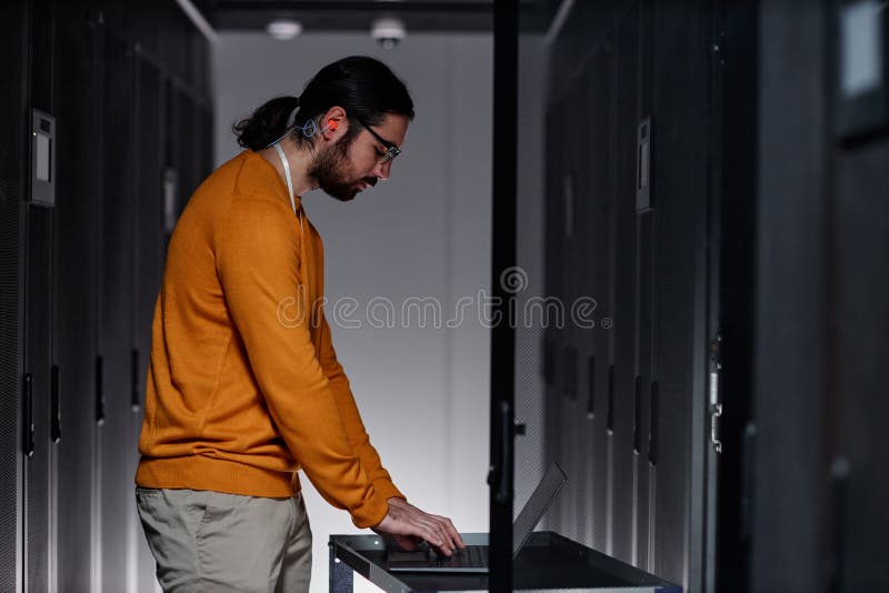 Bearded Network Engineer Using Laptop in Server Room Stock Photo ...