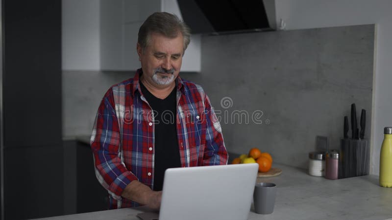 Bearded Old Man Using Laptop in Kitchen Stock Footage - Video of ...