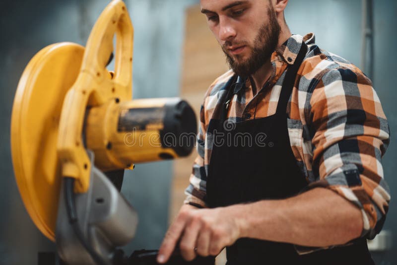 Bearded Service Mechanic Working on Electrical Grinding Machine in ...
