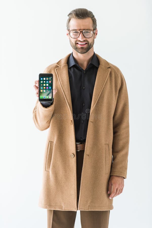 Bearded Smiling Man in Coat Presenting Iphone Editorial Photography ...