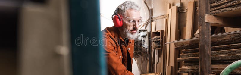 Bearded Woodworker in Earmuffs and Goggles Stock Image - Image of ...