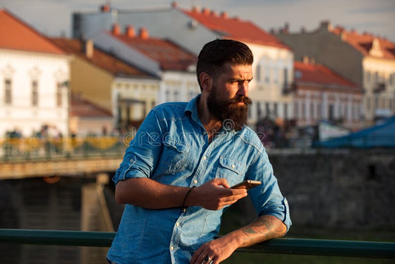 Bearded Young Man Texting on the Cell Phone. Stock Image - Image of ...