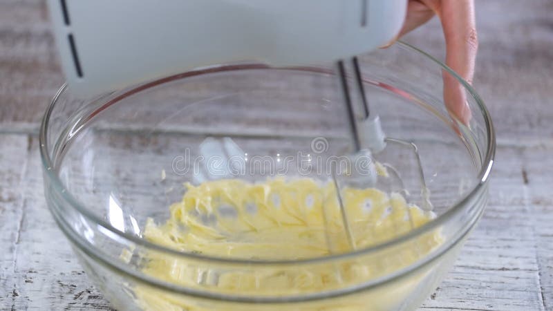 Beat the Butter in a Bowl. the Process of Making Cream for a Cake ...