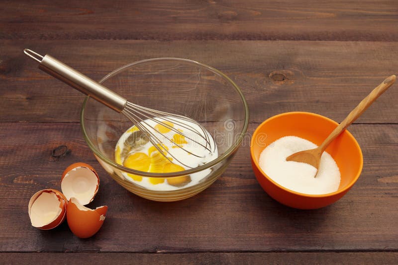 Beat Eggs with Milk To Make Dough on Rustic Table Stock Photo - Image ...