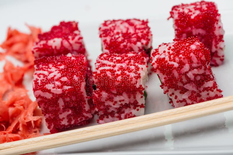 Beaters from Rice with Red Fish Roe, Marinated Ginger and Wooden Sticks ...