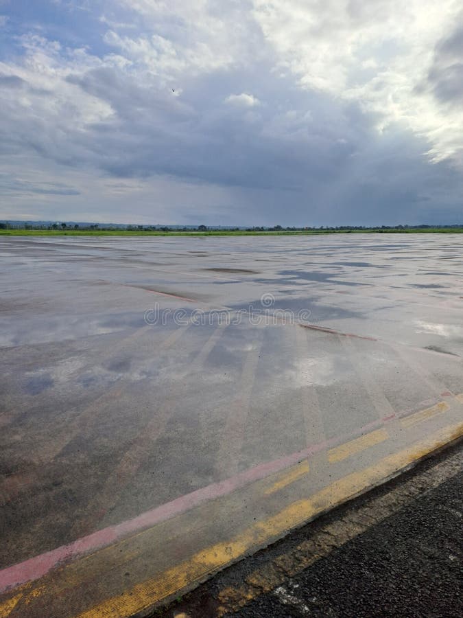 A Beatiful Sky Above the Wet Runway Stock Image - Image of airport ...
