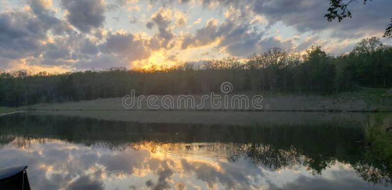 Beatiful Sunset Reflecting in a Tranquil Pond Stock Photo - Image of ...