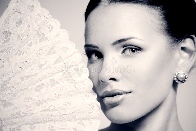 Beatiful woman with a fan stock photo. Image of hairstyles - 34823212
