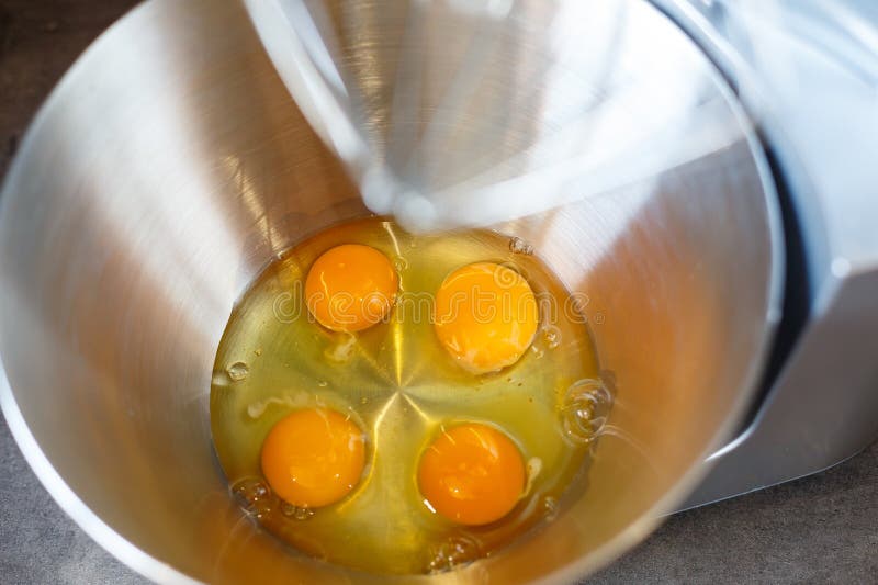 Beating Eggs with Sugar in a Kitchen Machine. Cream Nozzle Stock Photo ...