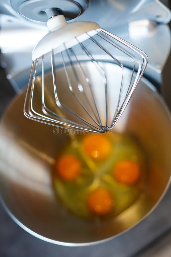 Beating Eggs with Sugar in a Kitchen Machine. Cream Nozzle Stock Photo ...