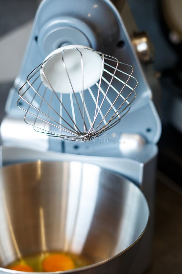 Beating Eggs with Sugar in a Kitchen Machine. Cream Nozzle Stock Photo ...