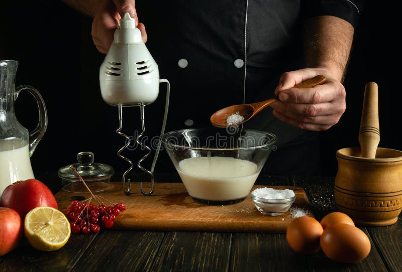 Beating Milk and Sugar with a Hand Mixer. Low Key Concept of the ...