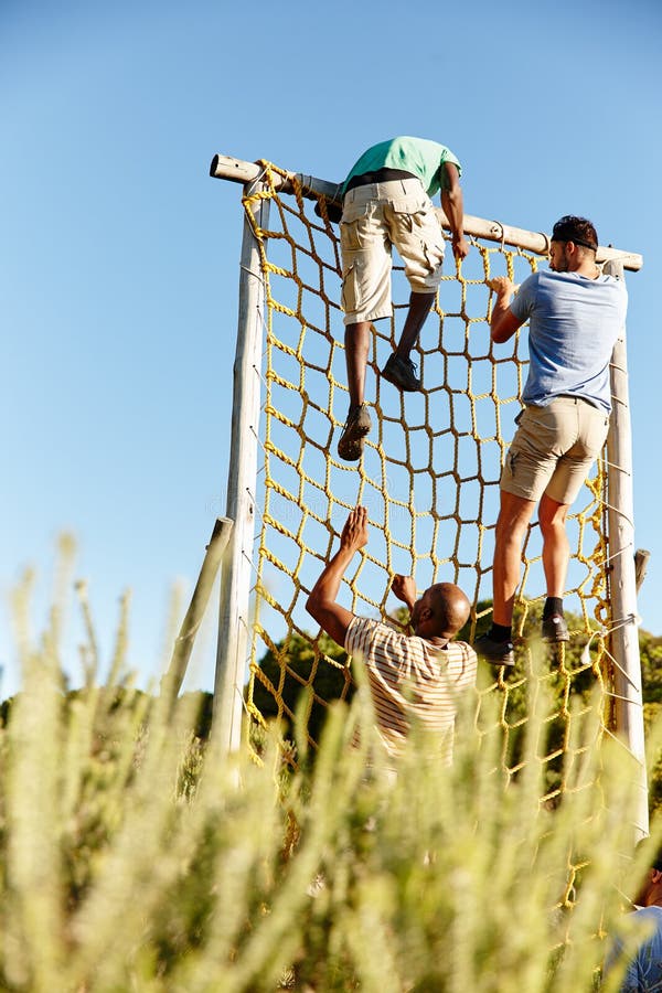 Energy and Persistence Conquer All Things. a Young Man Climbing Over an ...