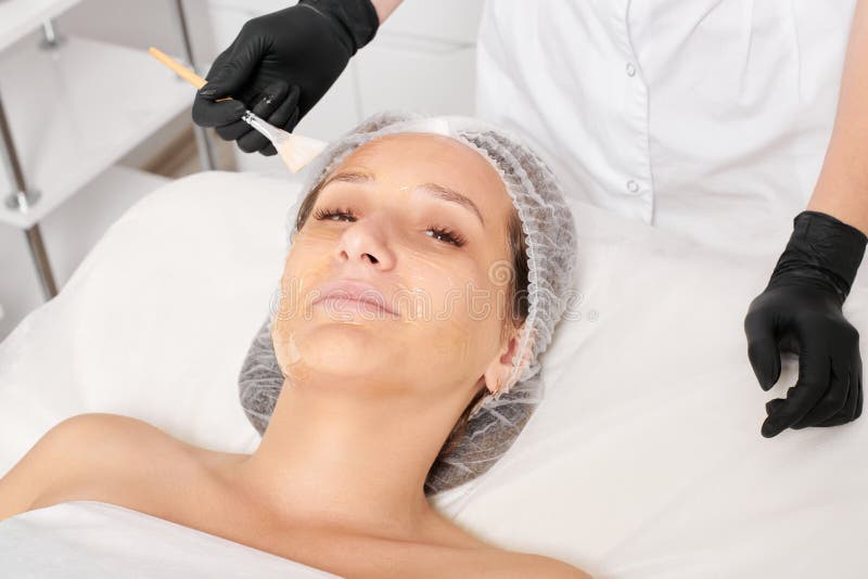 Beautician Applies Honey Mask On Woman Face For Moisturize Face Skin In