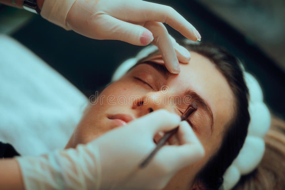 Beautician Finalizes the Stylized Shape of the Eyebrows of a Client ...