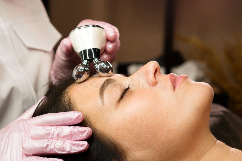 Beautician Performs Relaxing Microcurrent Forehead Massage on Client ...