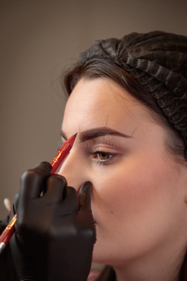 Beautician Drawing Eyebrow Shape on Client Face Using Pencil Stock ...