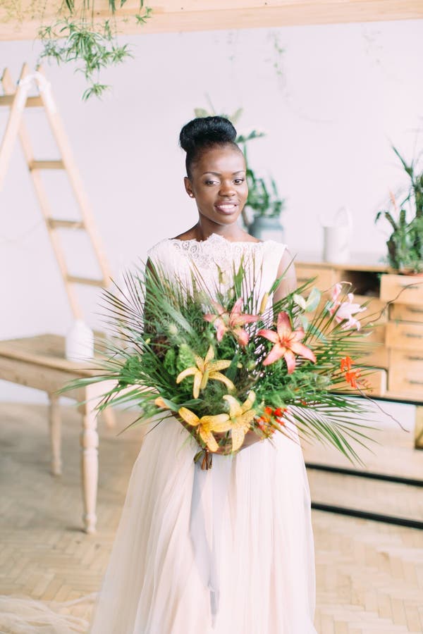 Beautiful African American Bride with Tropical Bouquet in Studio Stock ...