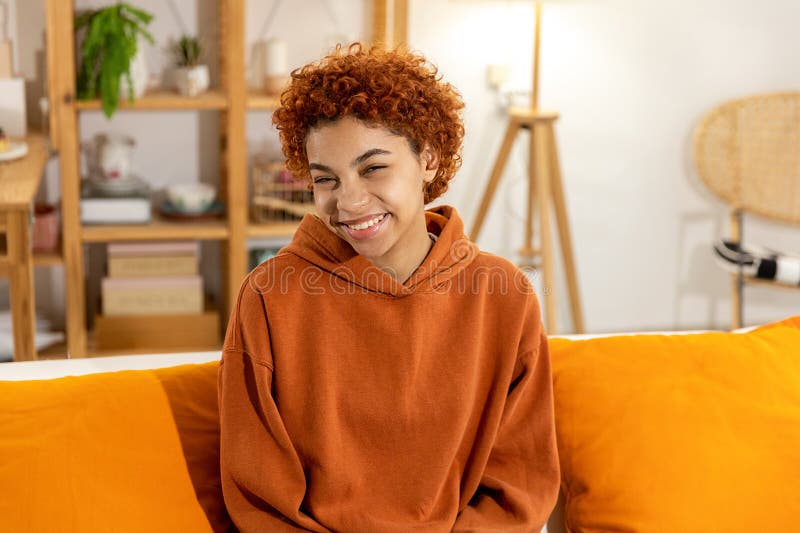 Beautiful African American Girl With Afro Hairstyle Smiling Sitting On