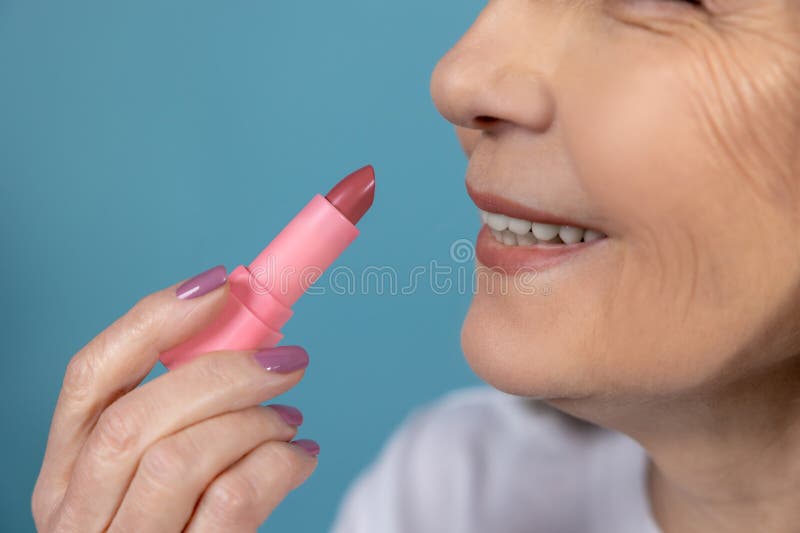 Beautiful Aging Woman with Lipstick Doing Makeup Stock Image - Image of ...