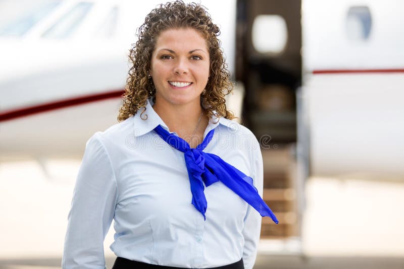 Beautiful Stewardess Standing Against Private Jet Stock Image - Image ...