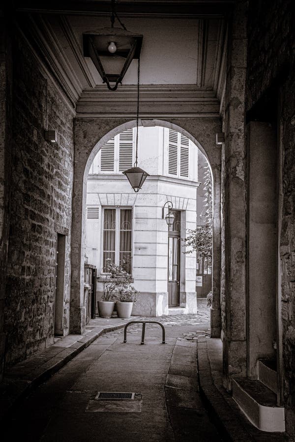 Beautiful alley in Paris stock image. Image of black - 246019069