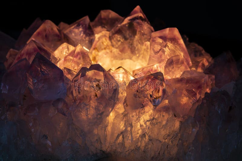 A Beautiful Amethyst Crystal Lit by Candle Light Stock Photo - Image of ...