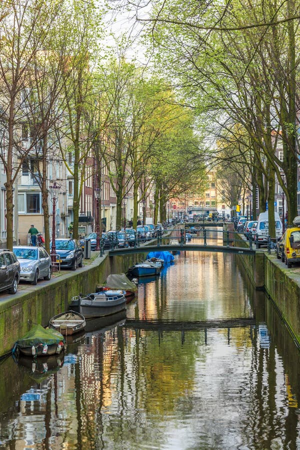 Amsterdam Canal in Portrait Editorial Image - Image of clouds, east ...