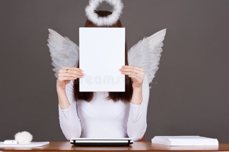 Angel sitting at a table stock image. Image of internet - 30315639