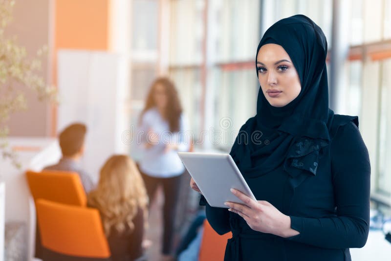 Beautiful Arabian Girl with Tablet Computer Working at Startup Office ...