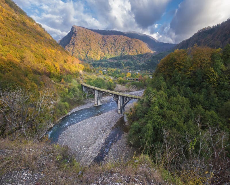 Beautiful Arched Bridge in the Autumn Mountains Over the River Stock ...