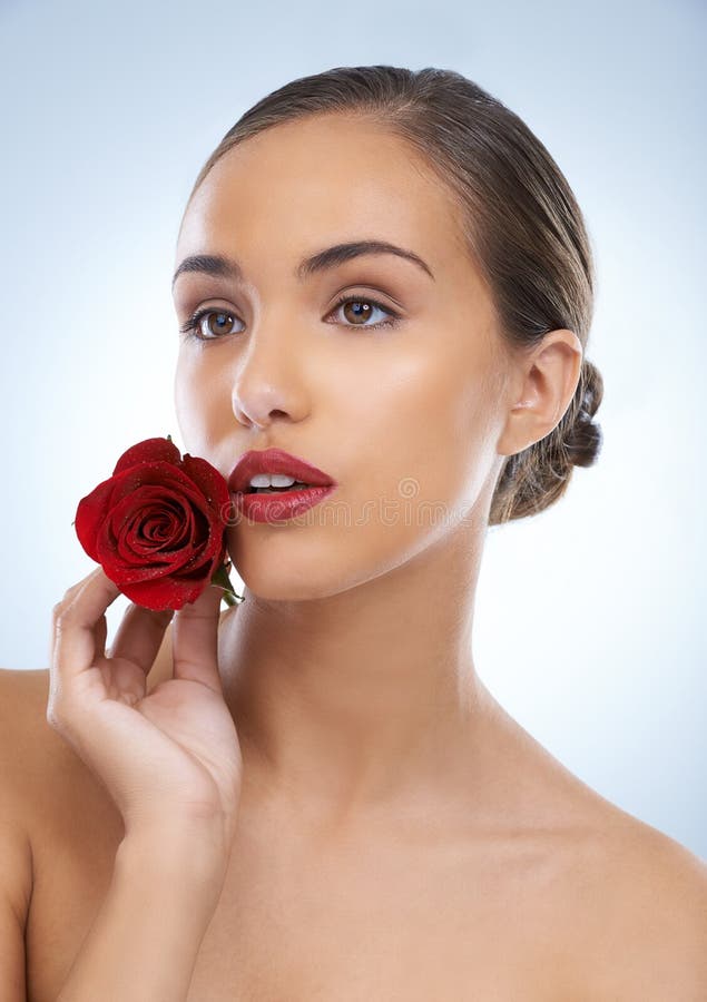 Beautiful As a Rose. Studio Shot of a Young Model Holding a Rose. Stock ...