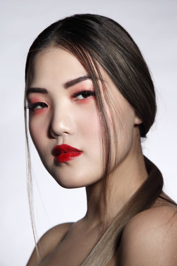 Beautiful Asian Girl With Long Hair And Red Lipstick Stock Image