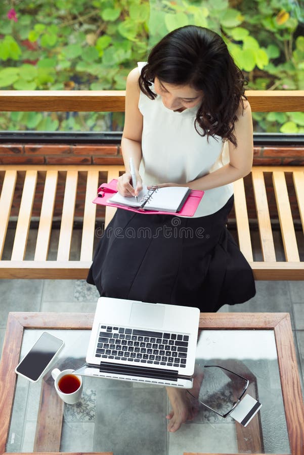 Beautiful Asian Girl Writing Notes in a Desk at Home Stock Photo ...