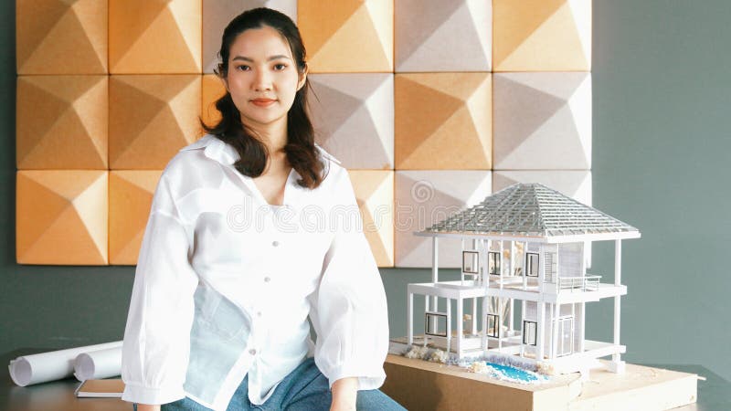 Beautiful Asian Project Manager Sitting Smiling at House Model ...
