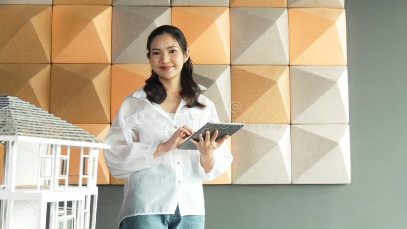 Beautiful Asian Project Manager Using Tablet Check House Model ...