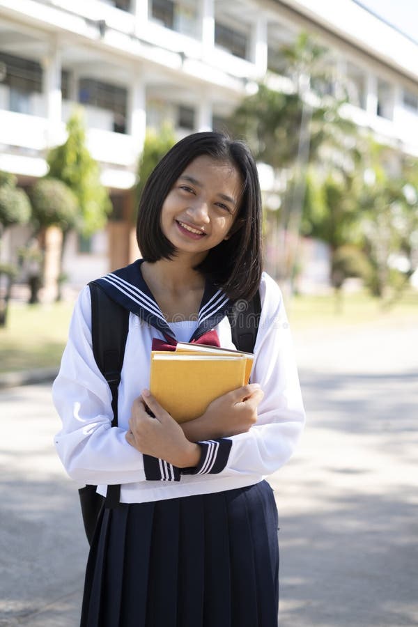 Beautiful Asian Student Hold Book at School Stock Photo - Image of ...