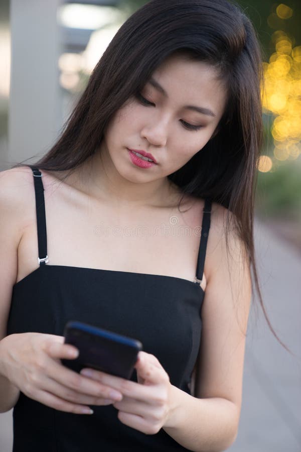 Beautiful Asian Woman Checking Her Text Messages Stock Image - Image of ...