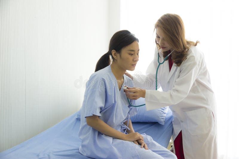 Beautiful Asian Woman Doctor Check Heartbeat With Stethoscope On Young