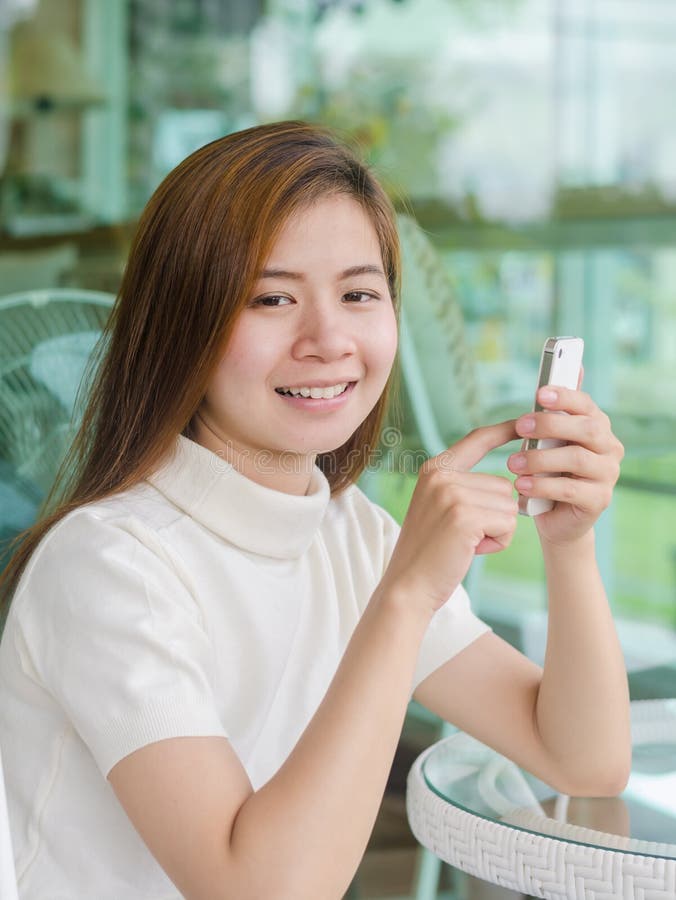 Beautiful Asian Woman Using a Smartphone . Stock Photo - Image of ...