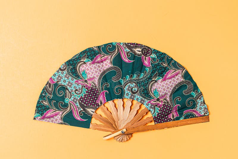 Beautiful Authentic Hand Fan with Bright Pattern on Yellow Background ... Beautiful Authentic Hand Fan with Bright Pattern on Yellow Background ...