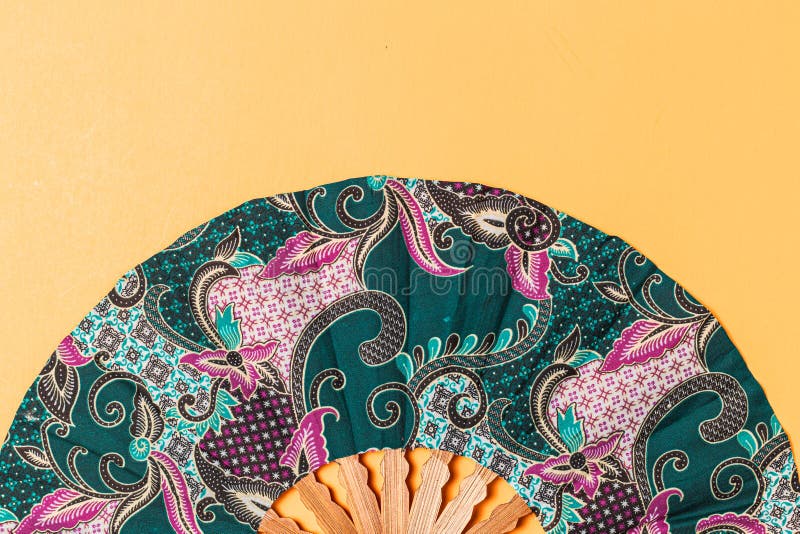 Beautiful Authentic Hand Fan with Bright Pattern on Yellow Background ... Beautiful Authentic Hand Fan with Bright Pattern on Yellow Background ...