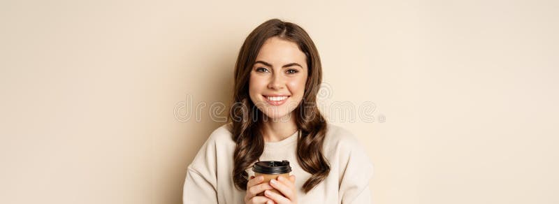 Beautiful Authentic Woman Smiling, Holding Warm Cup of Coffee and ... Beautiful Authentic Woman Smiling, Holding Warm Cup of Coffee and ...