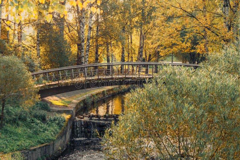 Beautiful Autumn Landscape with a Bridge Over a Small River Stock Image ...