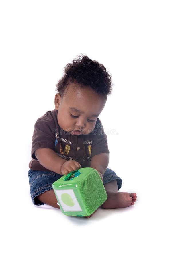 1 Year Old Baby Boy Standing Holding a Block Stock Photo - Image of ...