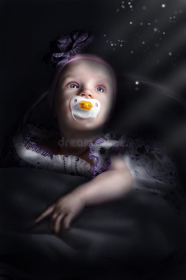 Beautiful Baby in Basket Looking at the Light Source Stock Photo ...