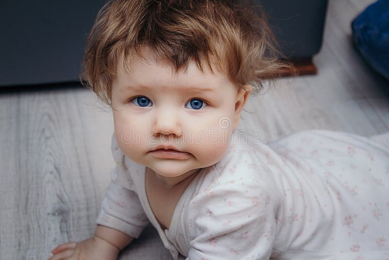 Beautiful Baby Crawling on the Floor and Looking at the Camera. Stock ...
