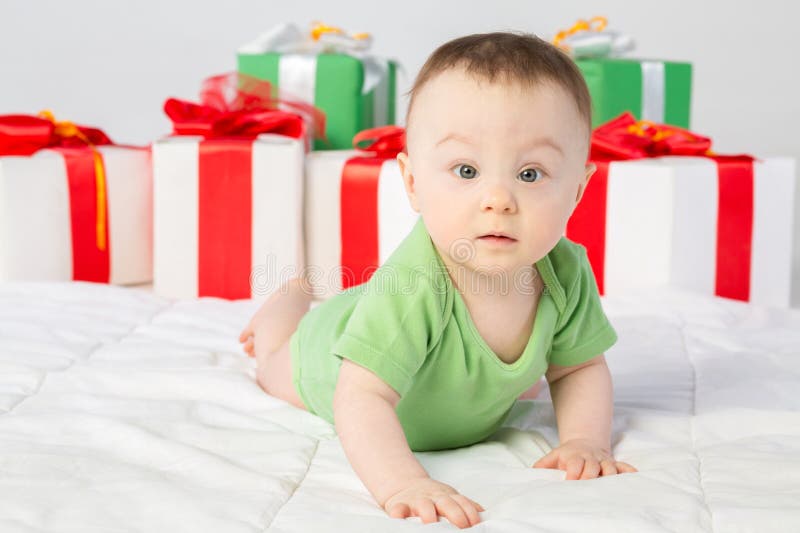 A Beautiful Baby Girl with a Gift Box on the Floor Stock Photo - Image ...